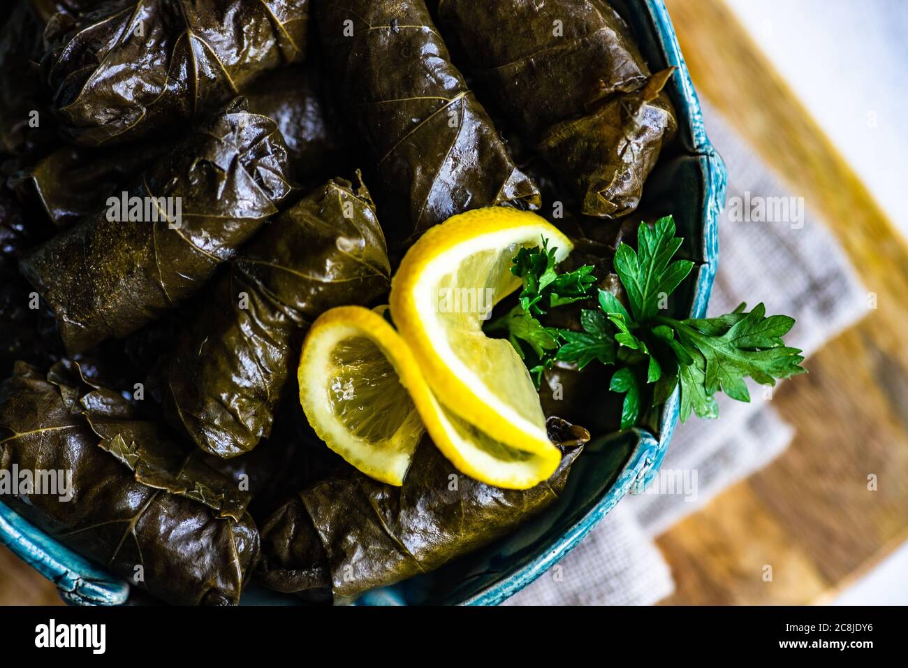 Traditional georgian tolma in vine leaves on rustic background with ...