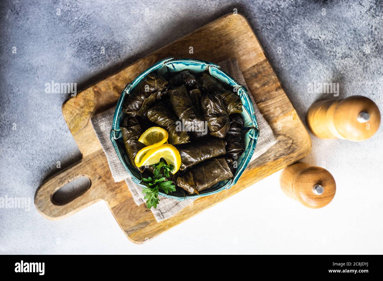 Traditional georgian tolma in vine leaves on rustic background with ...