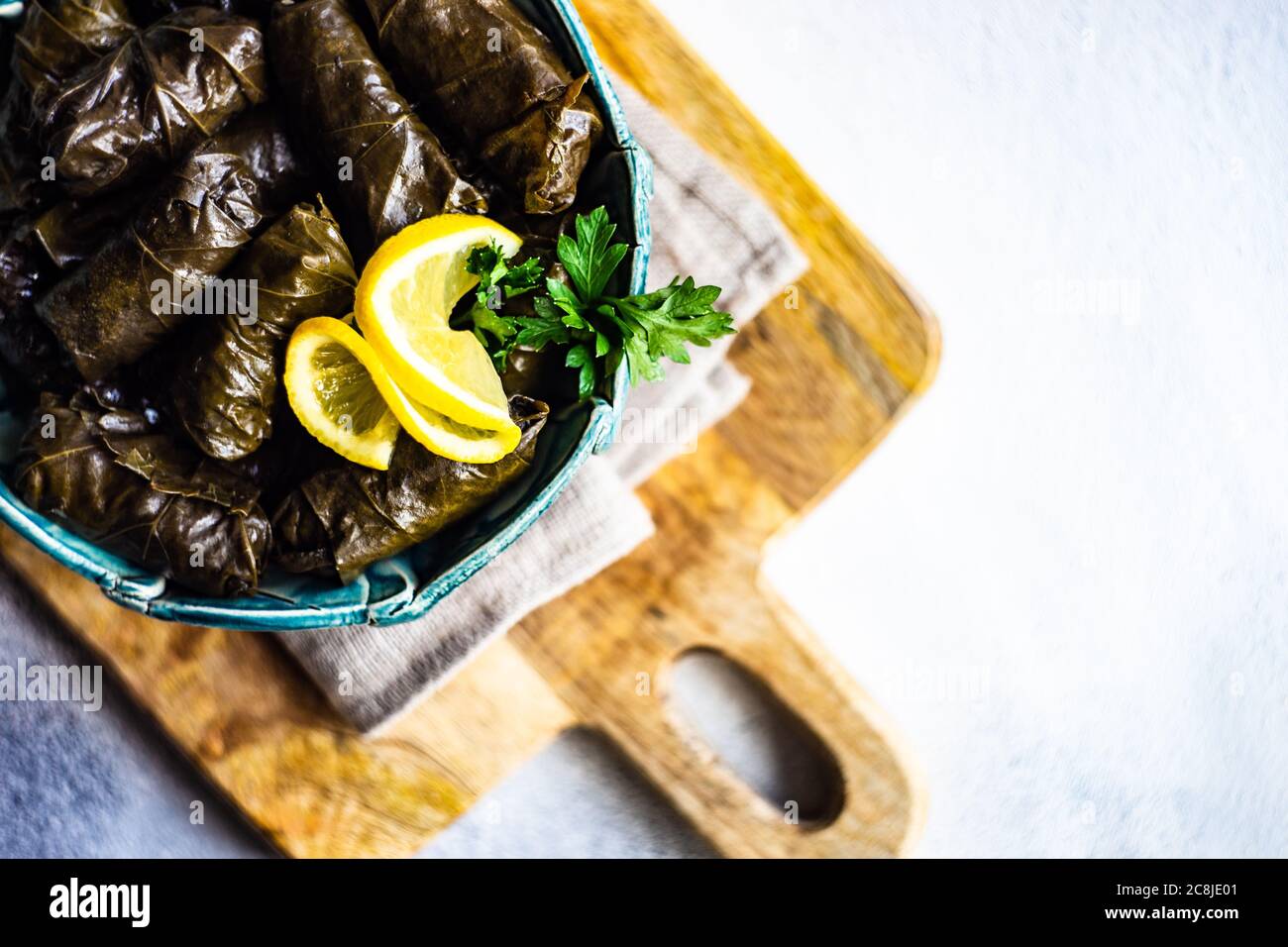 Traditional georgian tolma in vine leaves on rustic background with ...