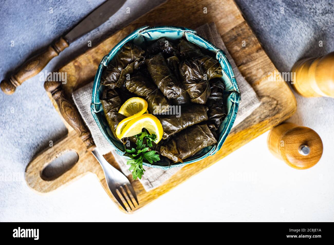 Traditional georgian tolma in vine leaves on rustic background with ...