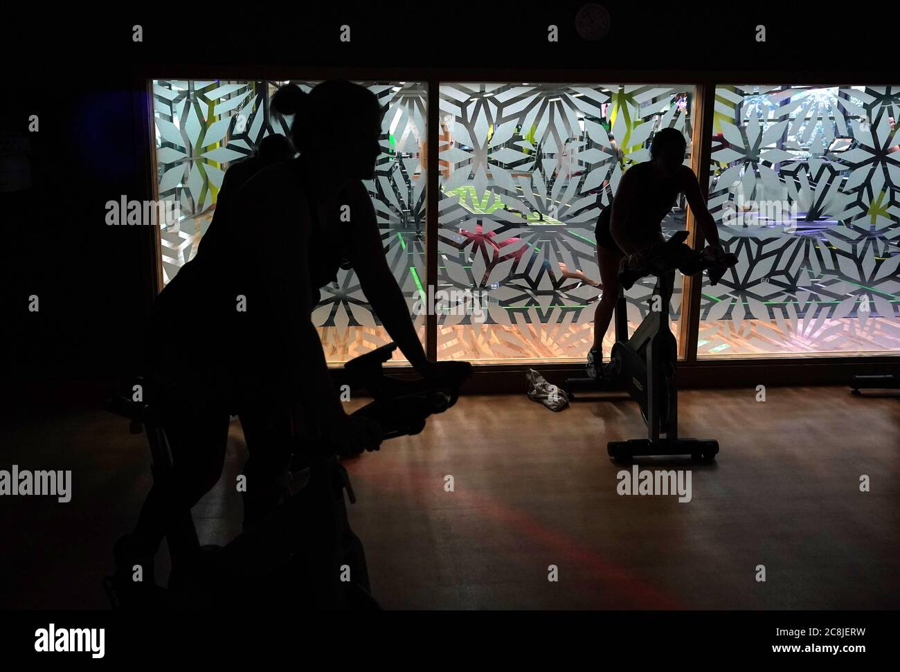Gym members exercise at Nuffield Health Sunbury gym as indoor gyms ...