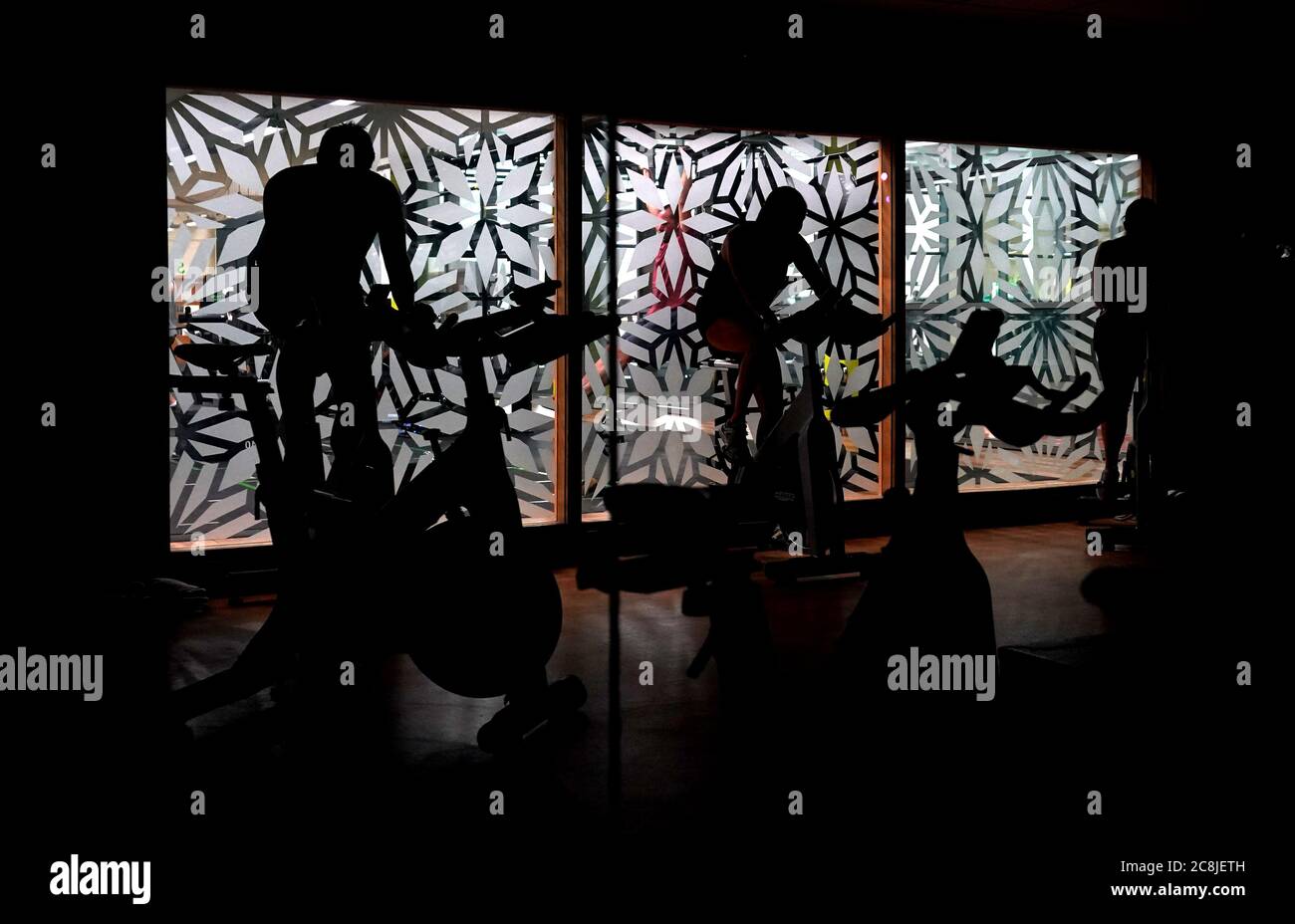 Gym members exercise at Nuffield Health Sunbury gym as indoor gyms ...