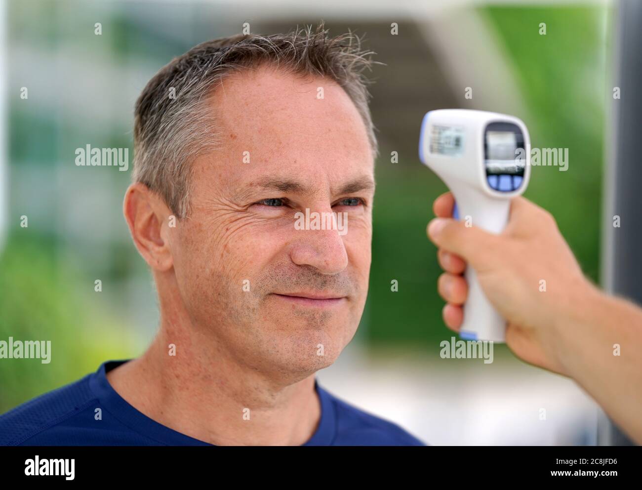 A gym member has their temperate checked at Nuffield Health Sunbury gym ...