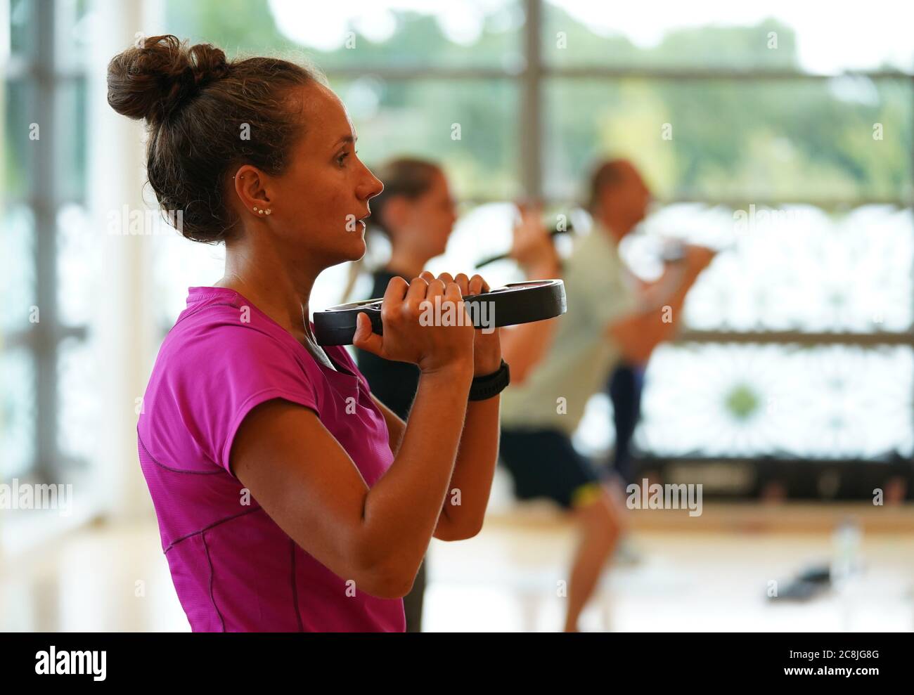 Gym members exercise at Nuffield Health Sunbury gym as indoor gyms ...