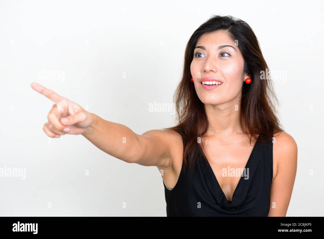 Portrait of happy young beautiful woman pointing finger Stock Photo - Alamy