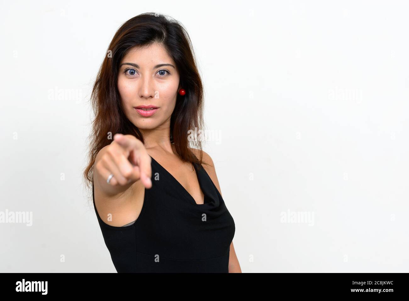 Portrait of young beautiful woman pointing at camera Stock Photo - Alamy