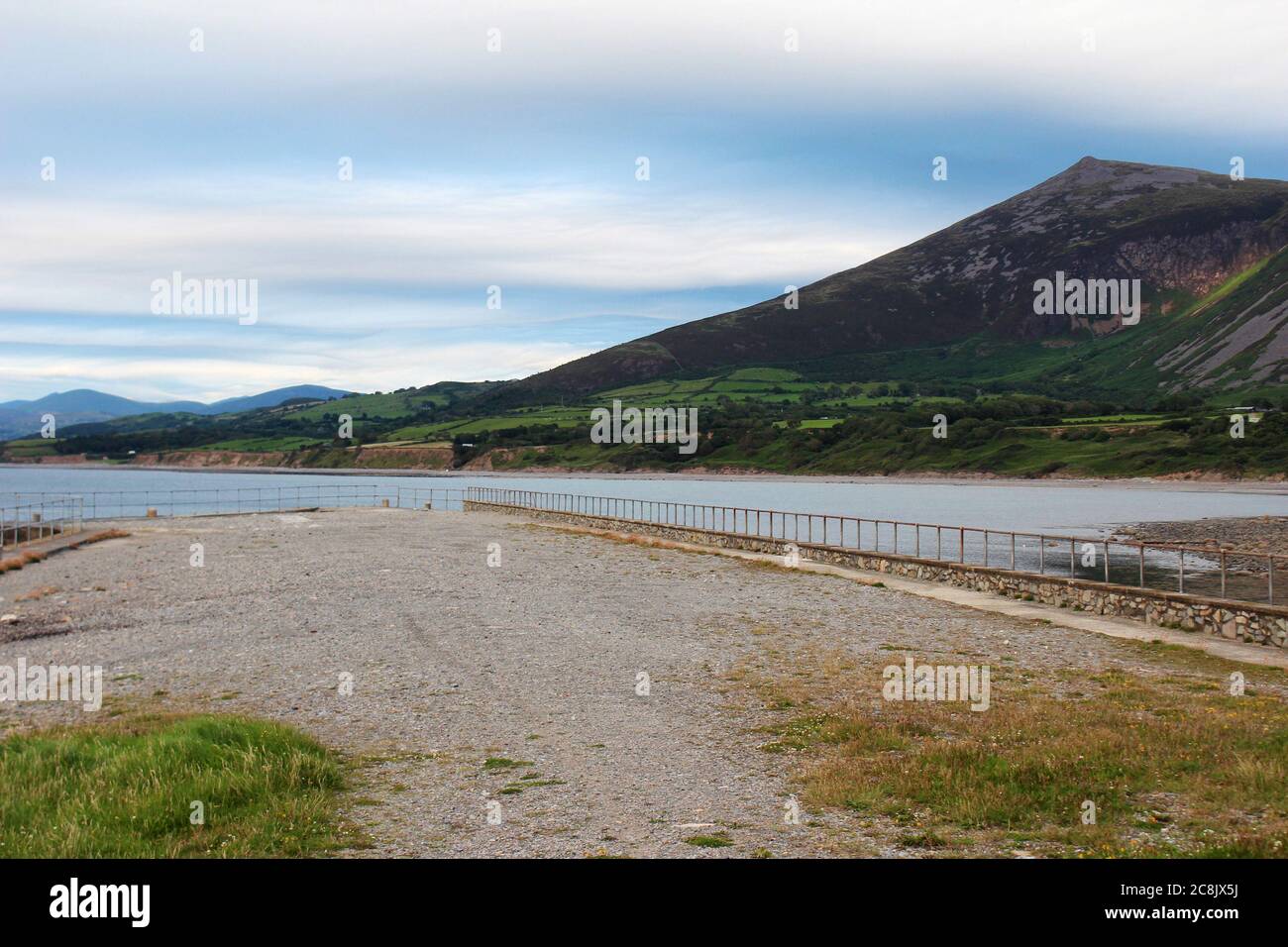 Top of sea wall/pier, looking out to the sea shore and the Rivals ...