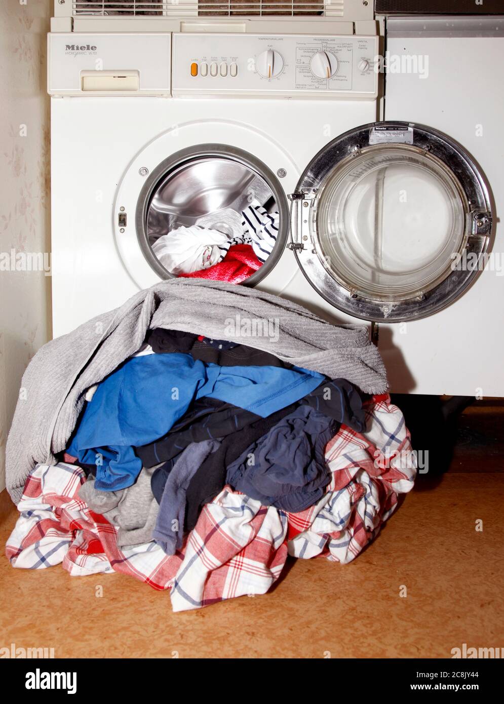 A washing machine full of laundry. Photo Jeppe Gustafsson Stock Photo ...