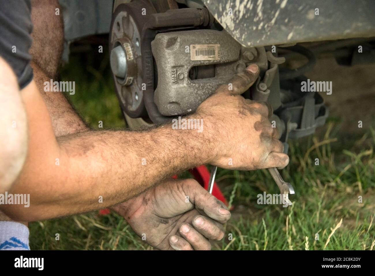 Mechanic replaces the brake pads Stock Photo - Alamy