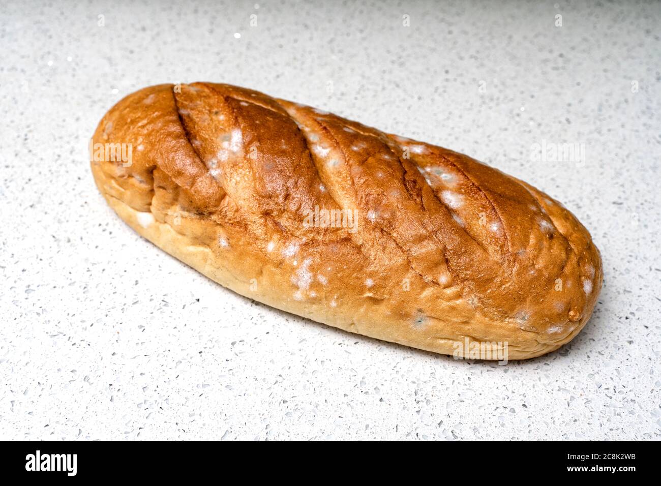 loaf with mold on a light surface. spoiled bread Stock Photo - Alamy