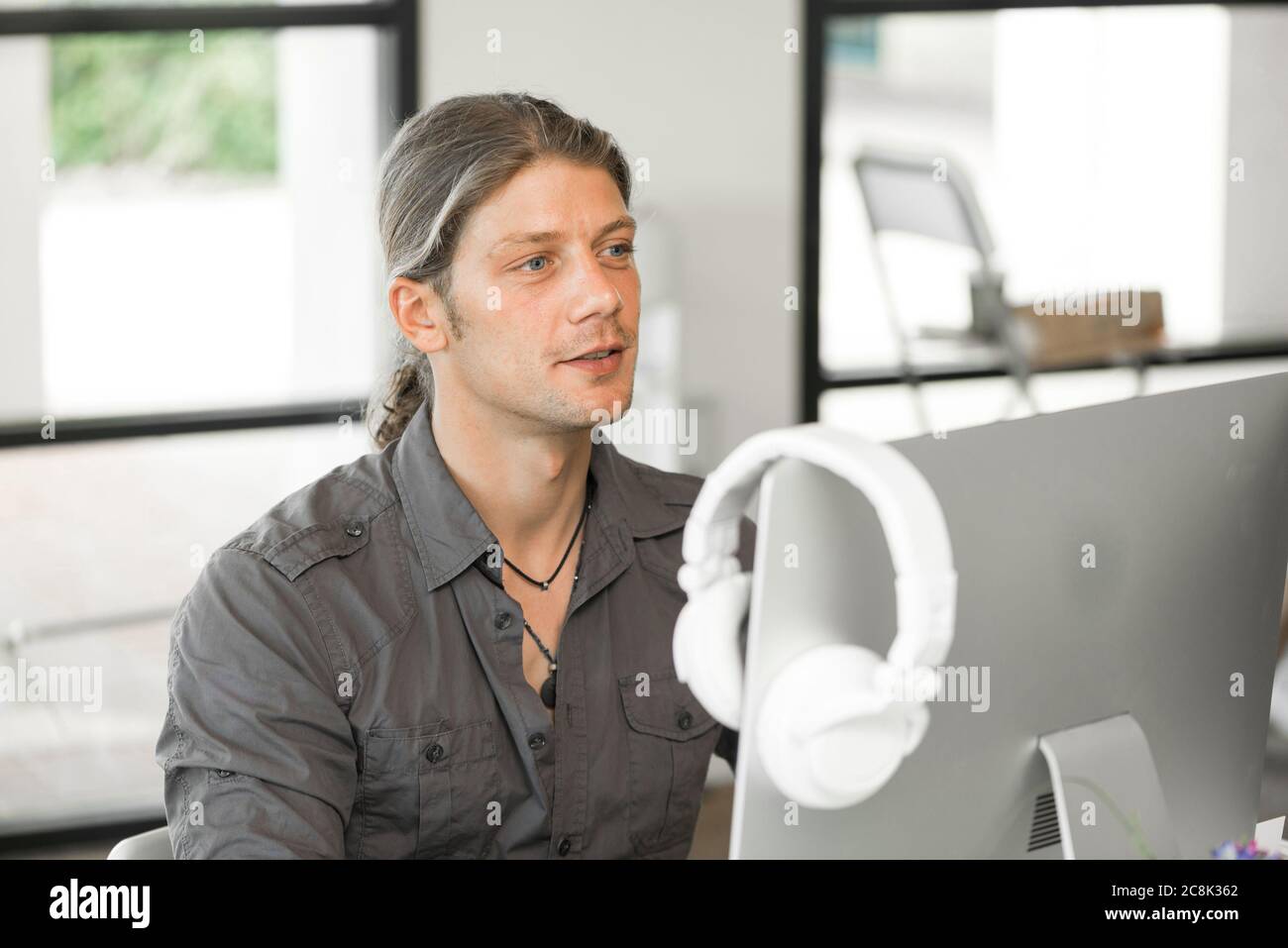 Handsome guy at computer work Stock Photo - Alamy
