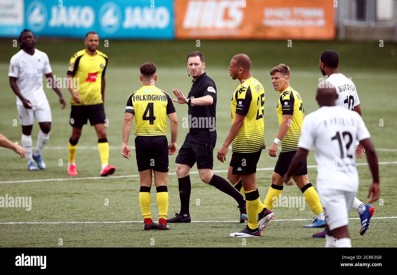 Referee Simon Mather clams down the players during the Vanarama ...
