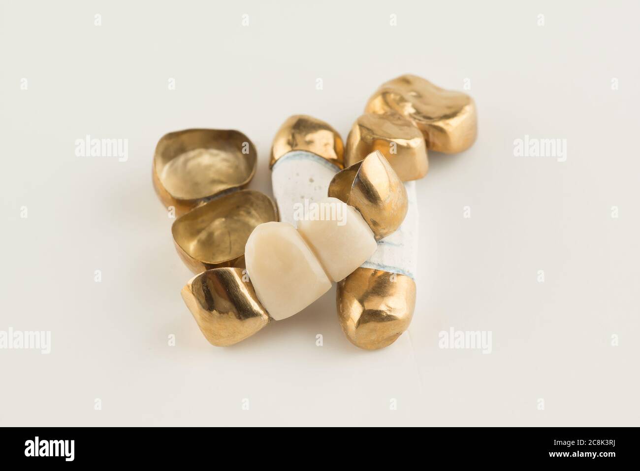 stamped brazed dental bridges covered with gold coated on white ...