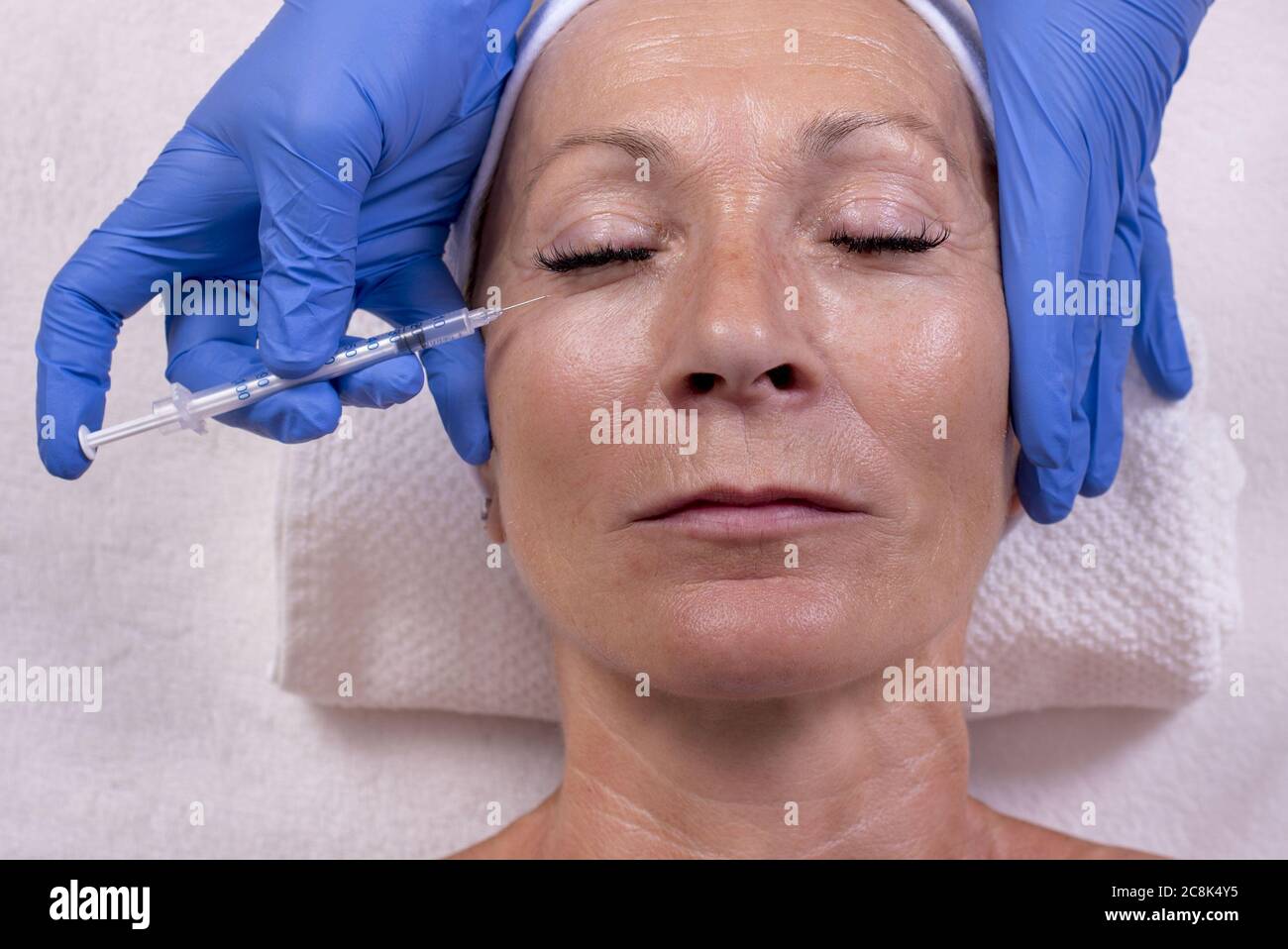 Portrait of a female getting a botox at a medical center Stock Photo ...