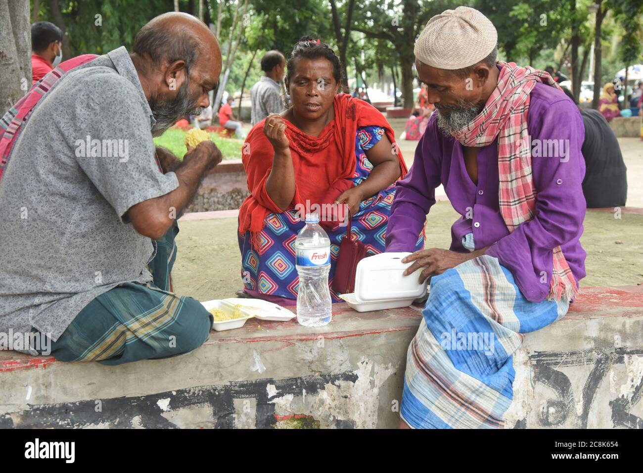Homeless indian man eating in hi-res stock photography and images - Alamy