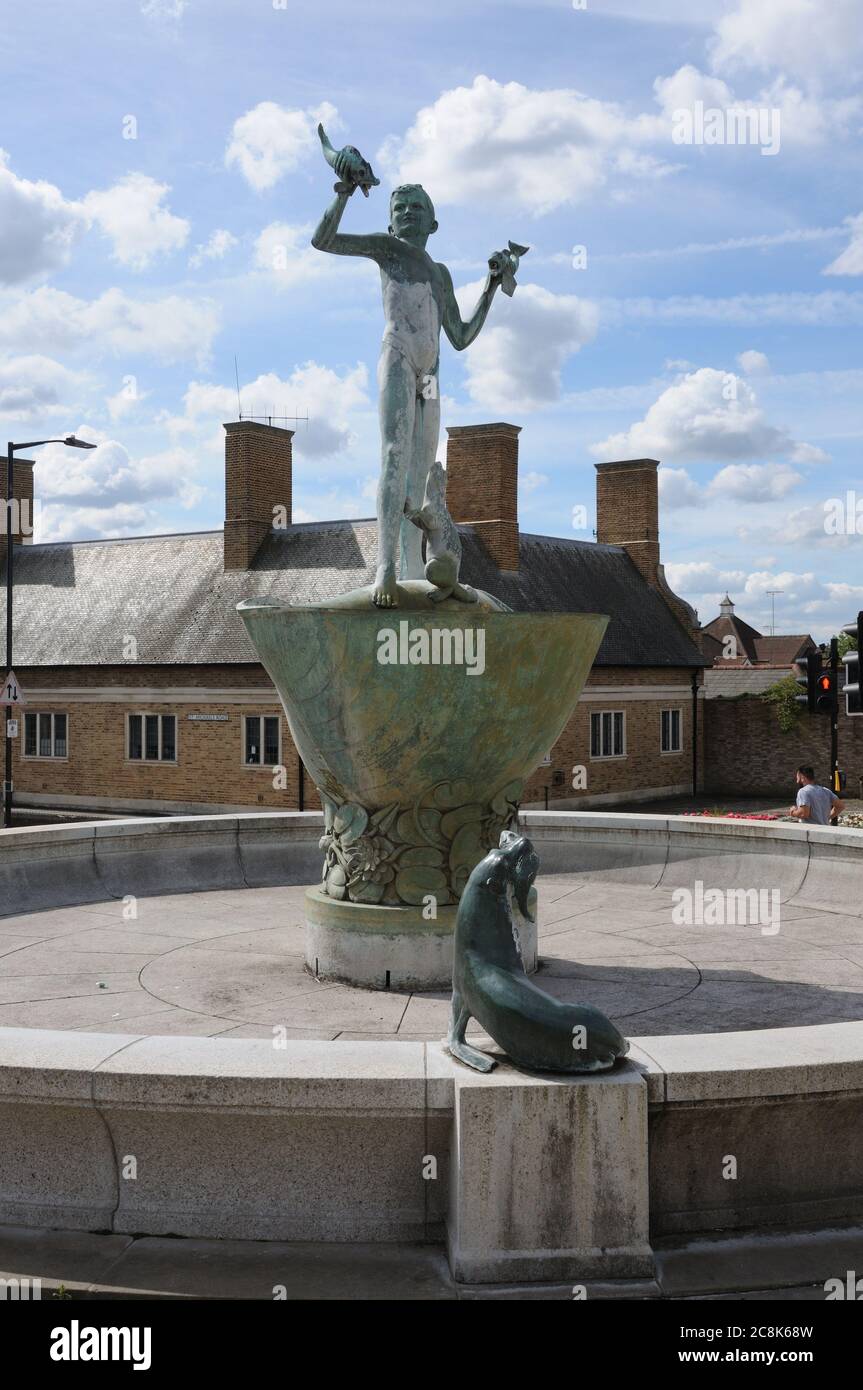 Statue of young boy hoding fish, Braintree, Essex Stock Photo - Alamy