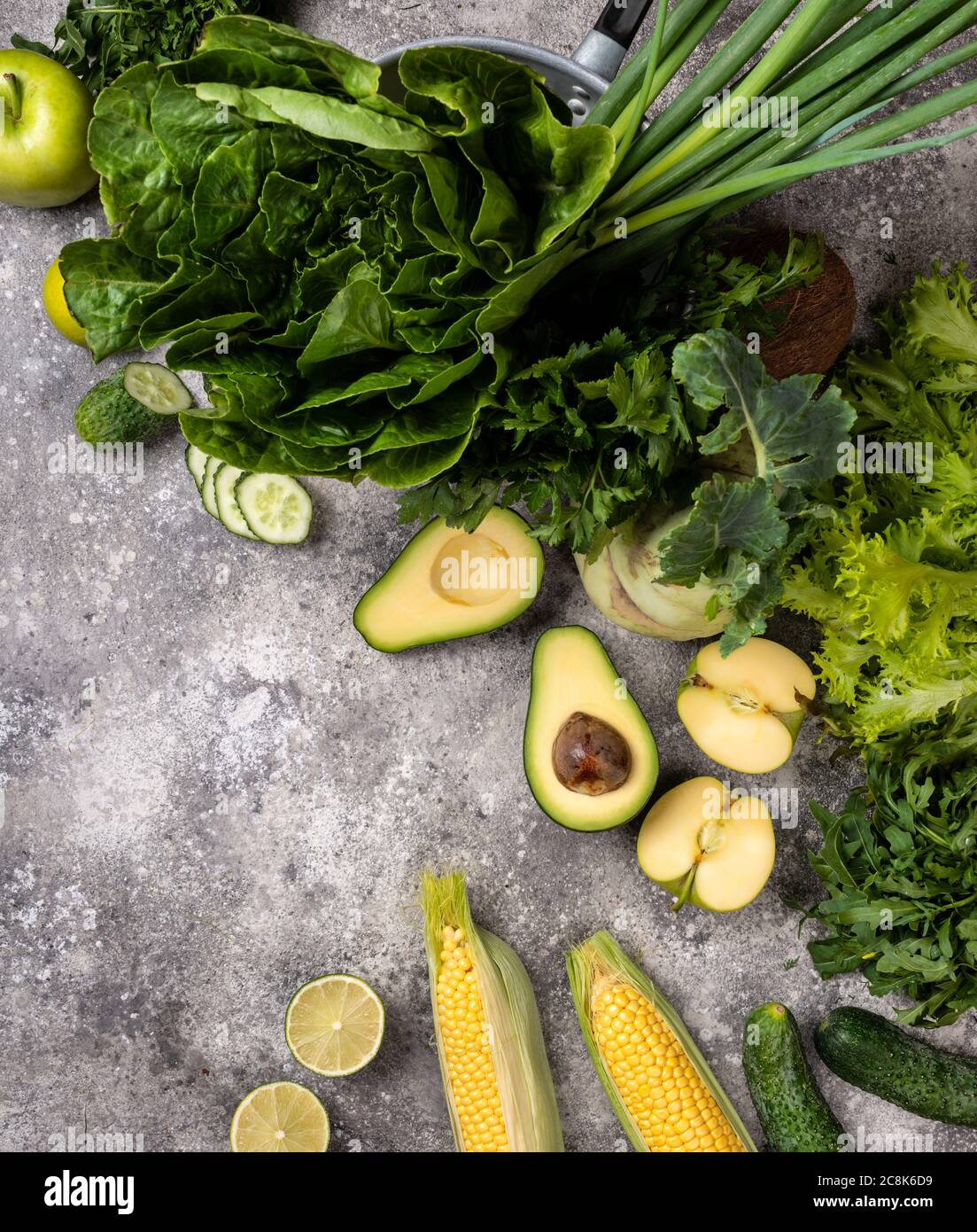 Different vegetables and greens on the grey background Stock Photo - Alamy
