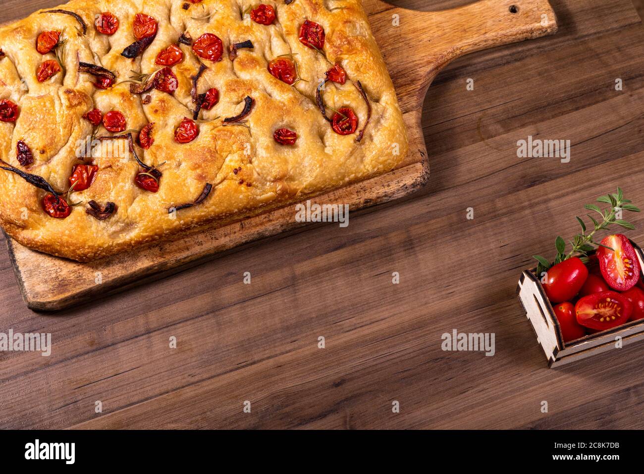 Traditional Italian Focaccia with cherry tomatoes, black olives and ...