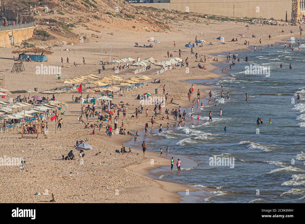BEIRUT LEBANON. 25 July, 2020. People cool off at a popular beach in ...