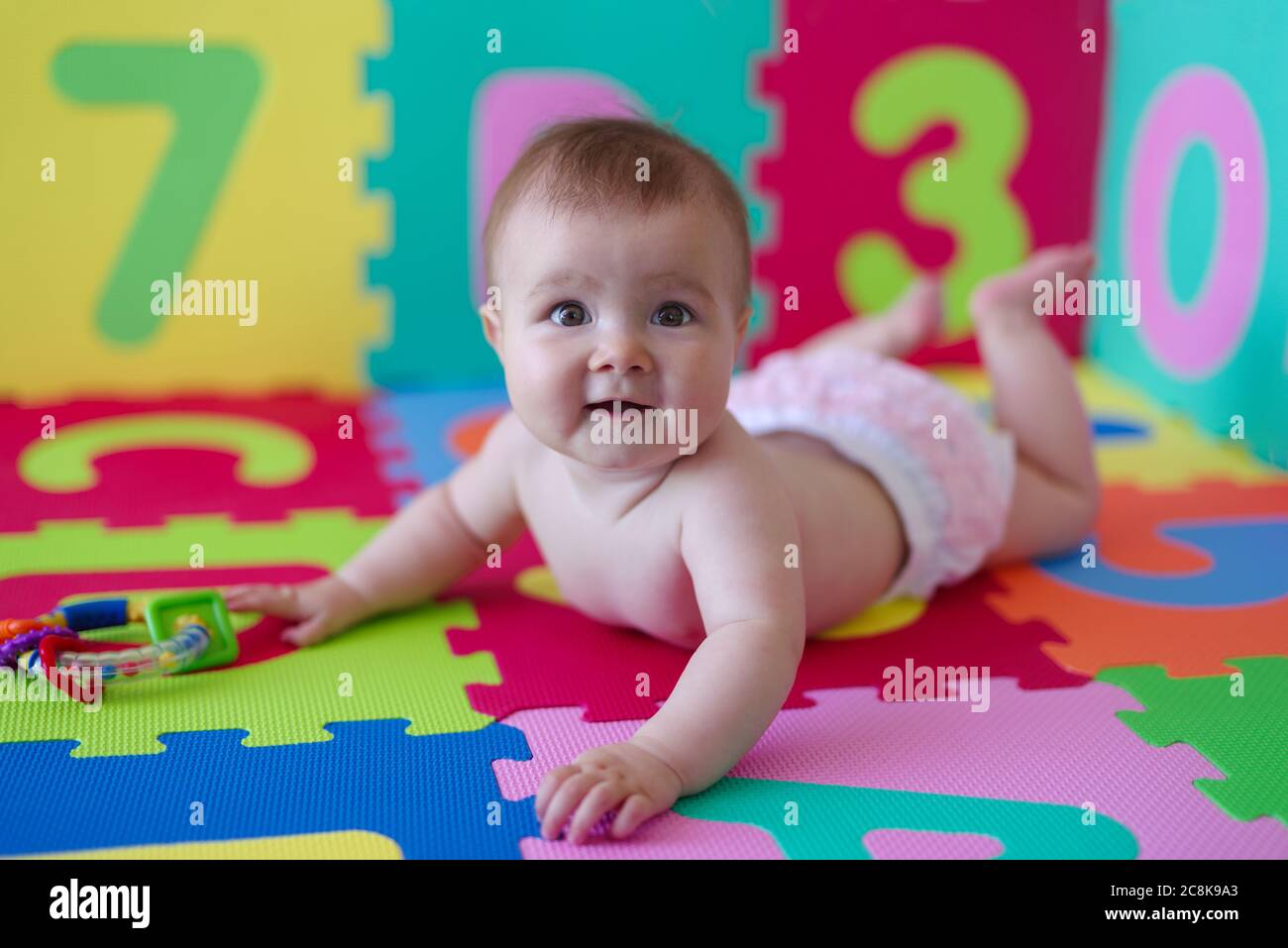 Children playing on mat hi-res stock photography and images - Alamy