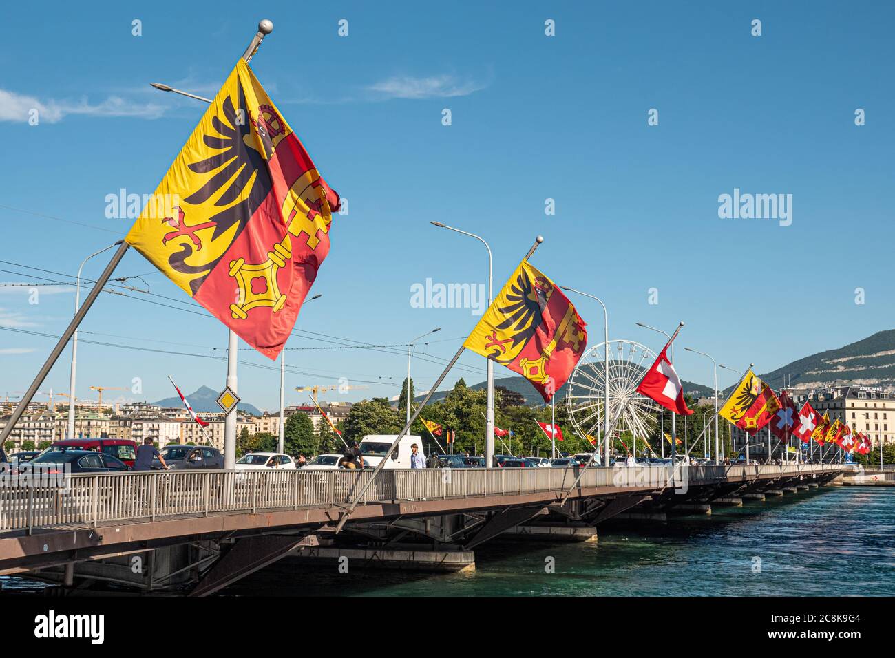 Flags of Switzerland and the City of Geneva on a bridge in Geneva ...