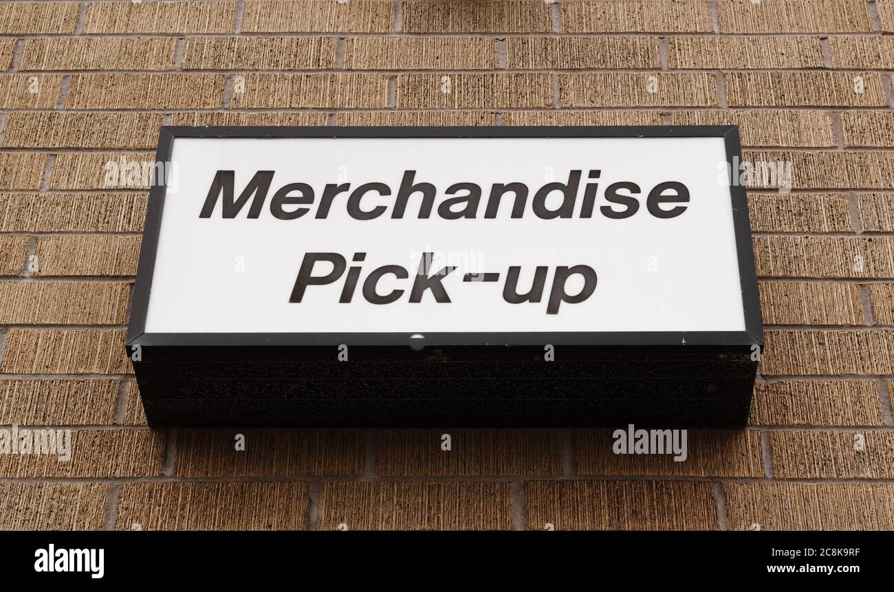 Store merchandise pick up sign on building brick wall Stock Photo - Alamy
