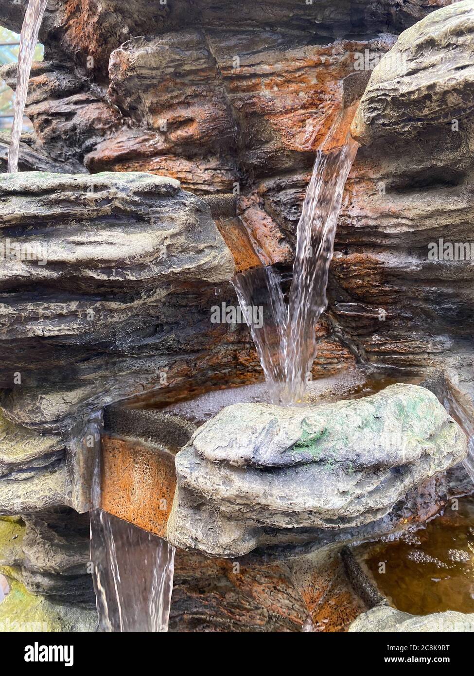 View on waterfall in german garden built with natural stones - Germany ...