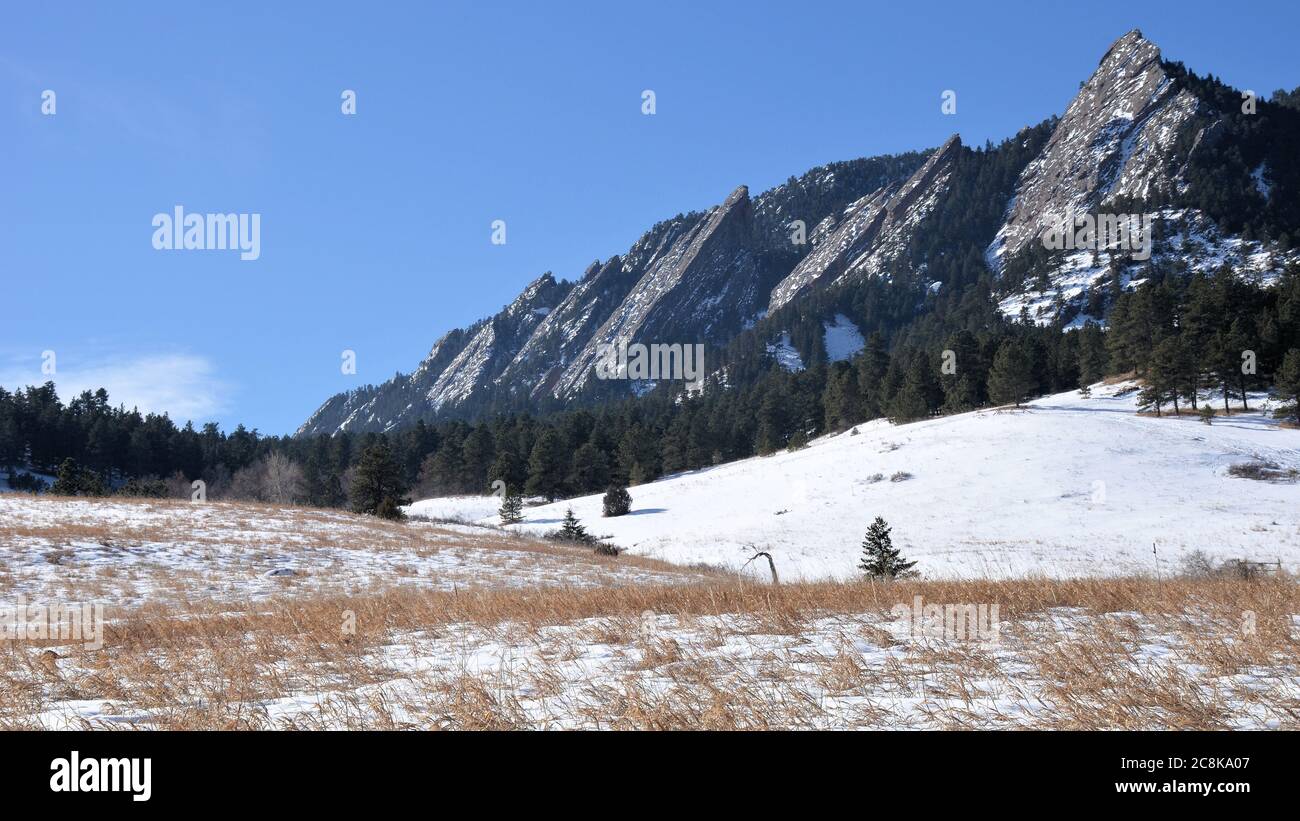 Snow dusts the iconic flatirons formation in the Rocky Mountain ...