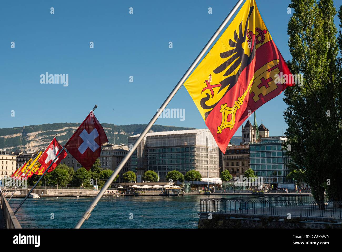 Flags of Switzerland and the City of Geneva on a bridge in Geneva ...
