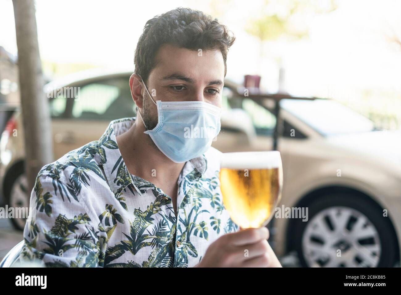 Man looking wearing face mask masks covid 19 hi-res stock photography ...
