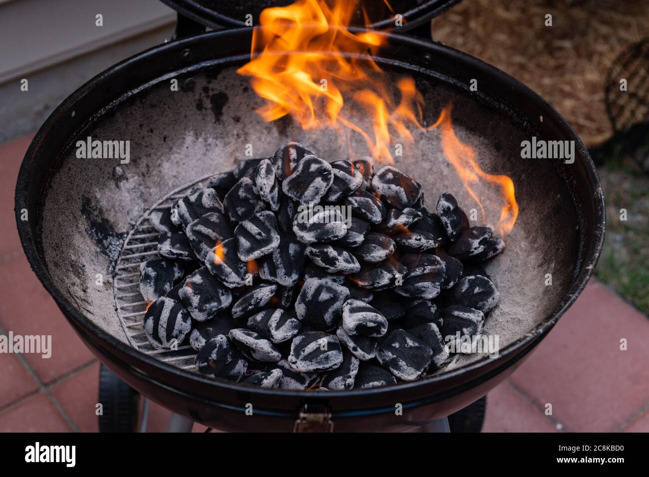 Close-up of blazing fire in rustic BBQ grill at evening Stock Photo - Alamy