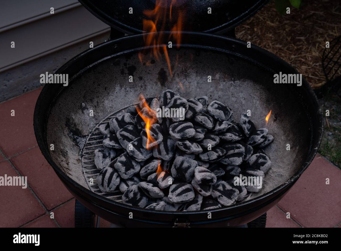 Close-up of blazing fire in rustic BBQ grill at evening Stock Photo - Alamy