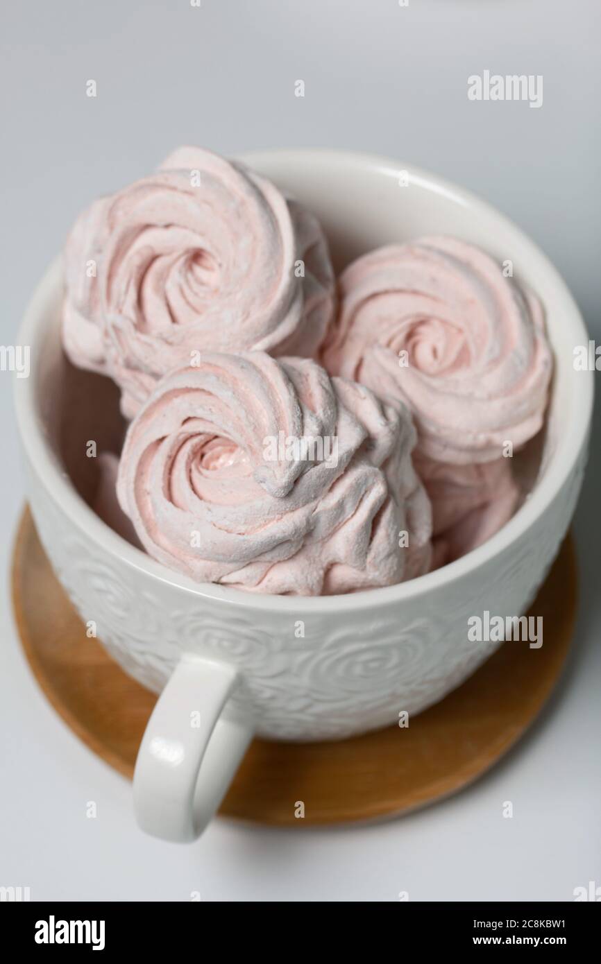 Homemade zephyr in a mug. On the white surface Stock Photo - Alamy