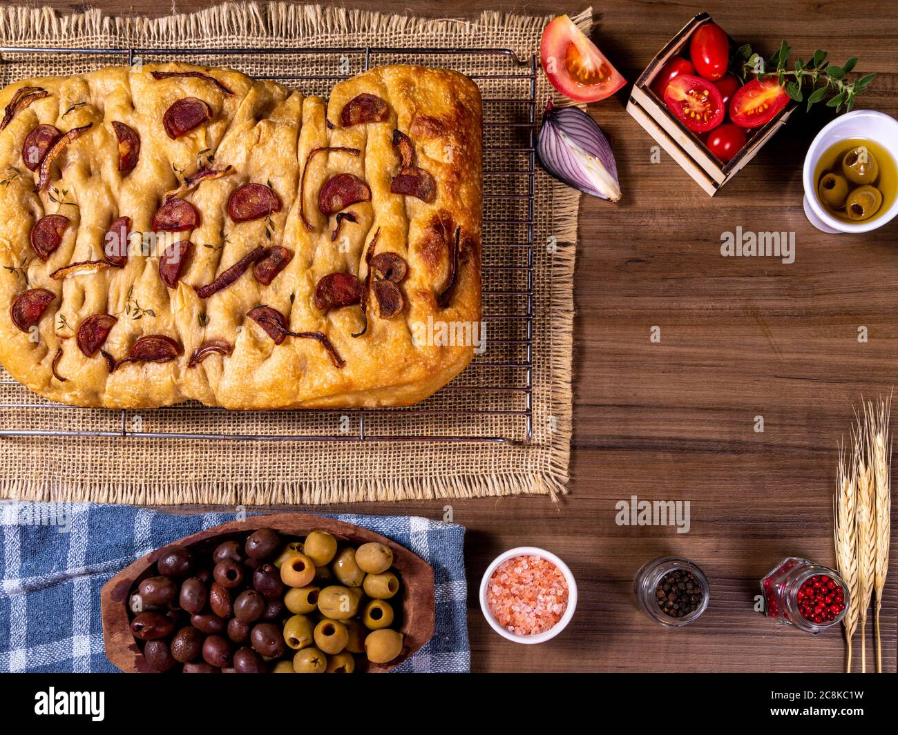 Traditional Italian Focaccia with pepperoni, cherry tomatoes, black ...