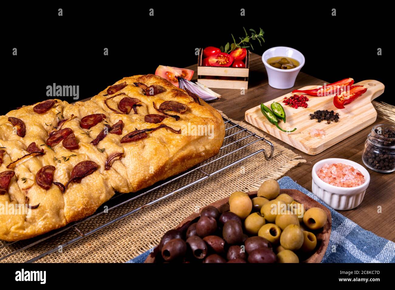 Traditional Italian Focaccia with pepperoni, cherry tomatoes, black ...