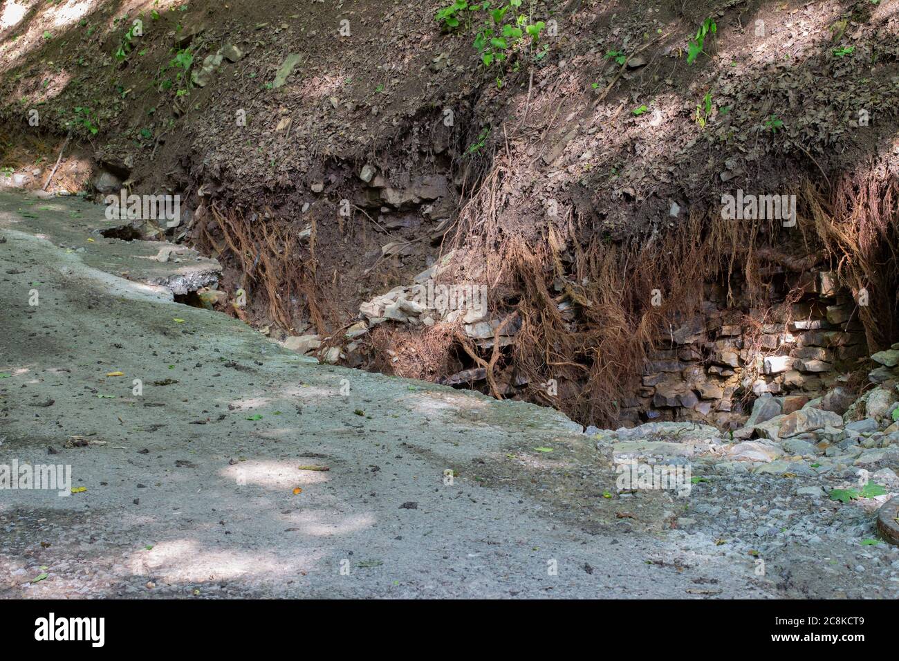 Road damage and destroyed blank roots after a flood Stock Photo - Alamy