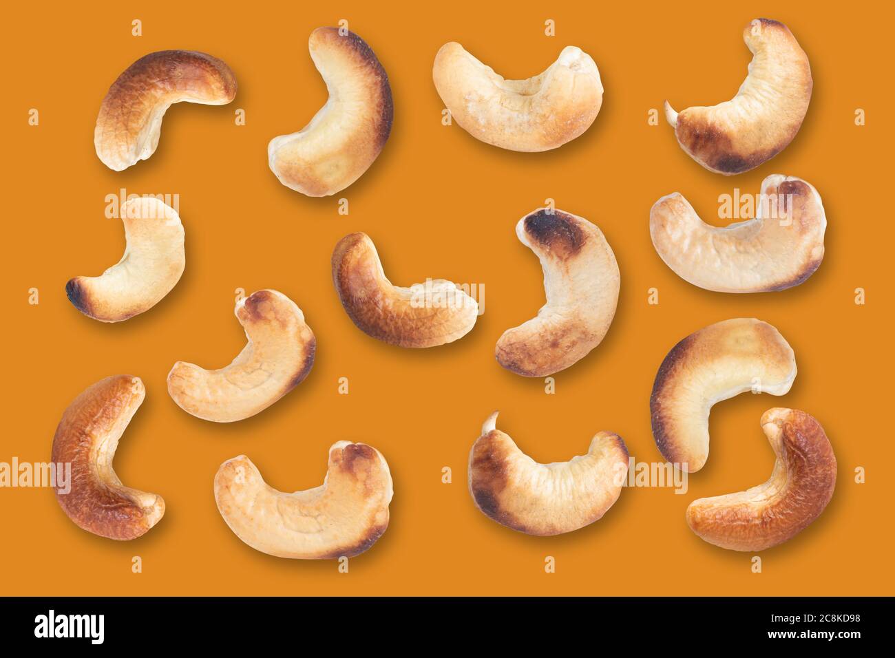Cashews pattern on a orange background. Nuts creative layout. Top view ...
