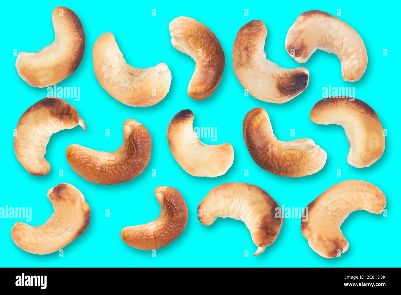 Cashews pattern on a green water background. Nuts creative layout. Top ...