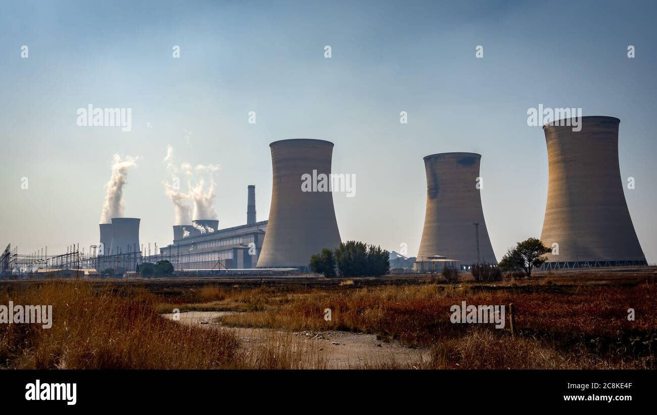 Coal power generating station with cooling towers in dry landscape ...