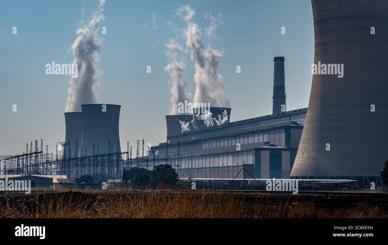 Coal power generating station with cooling towers in dry landscape ...