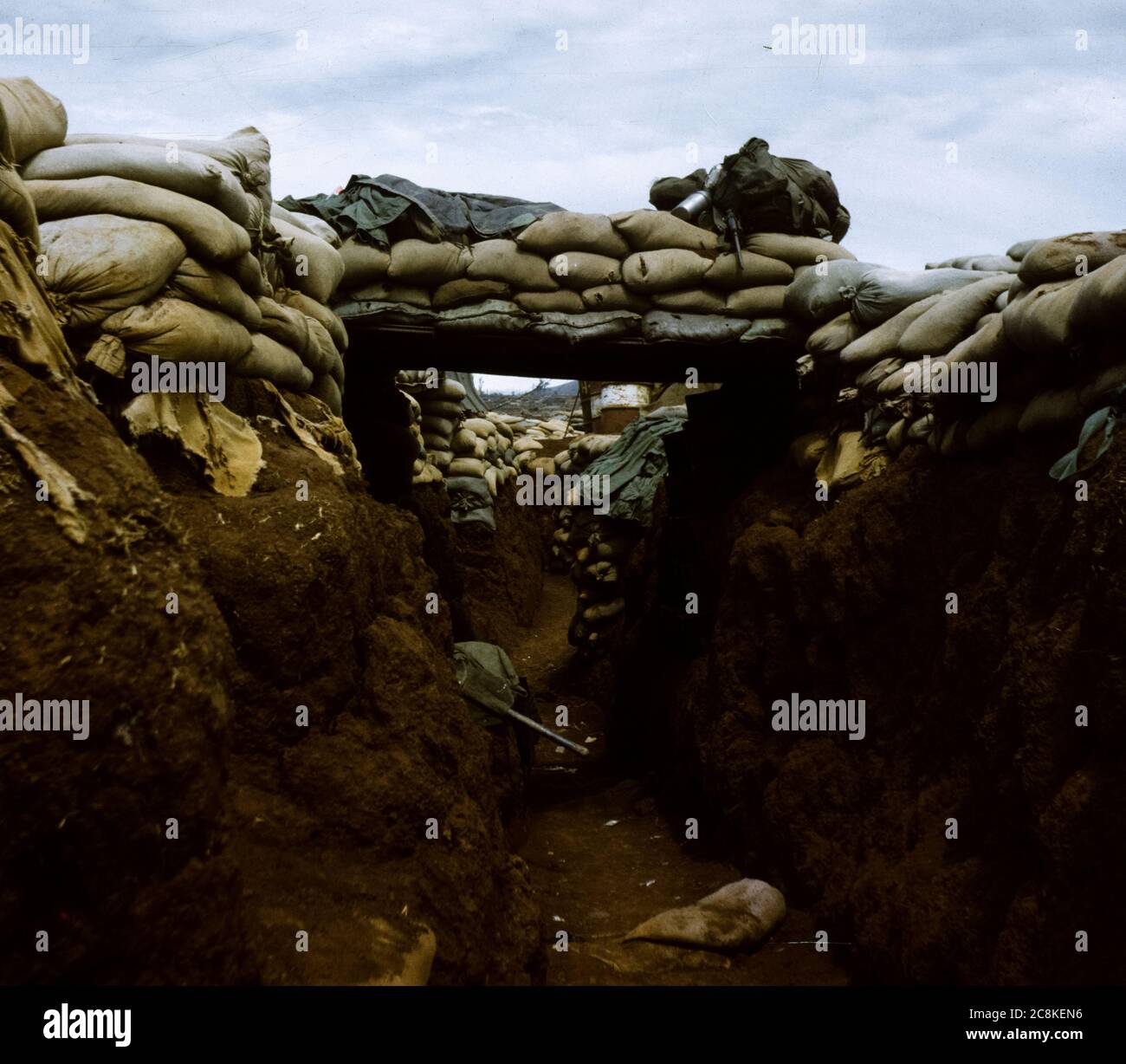 Fox hole trench with sandbags in 1968 during the Vietnam War. Landscape ...