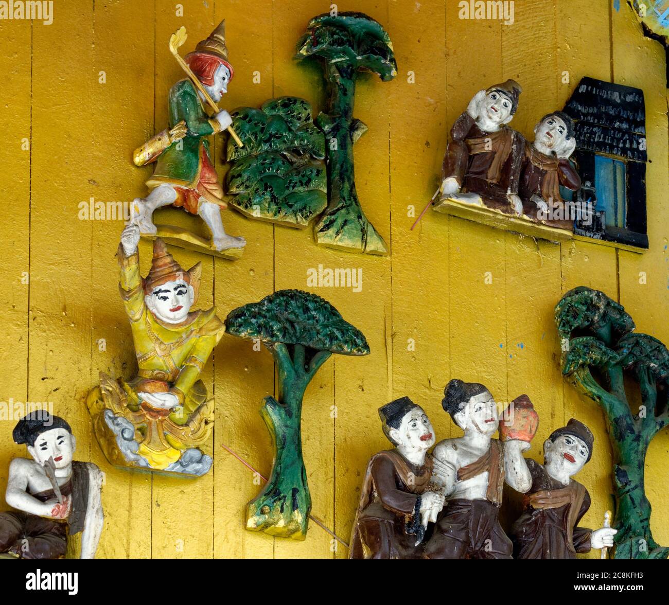 Burmese carvings decorated a yellow wooden wall within the Shwedagon ...