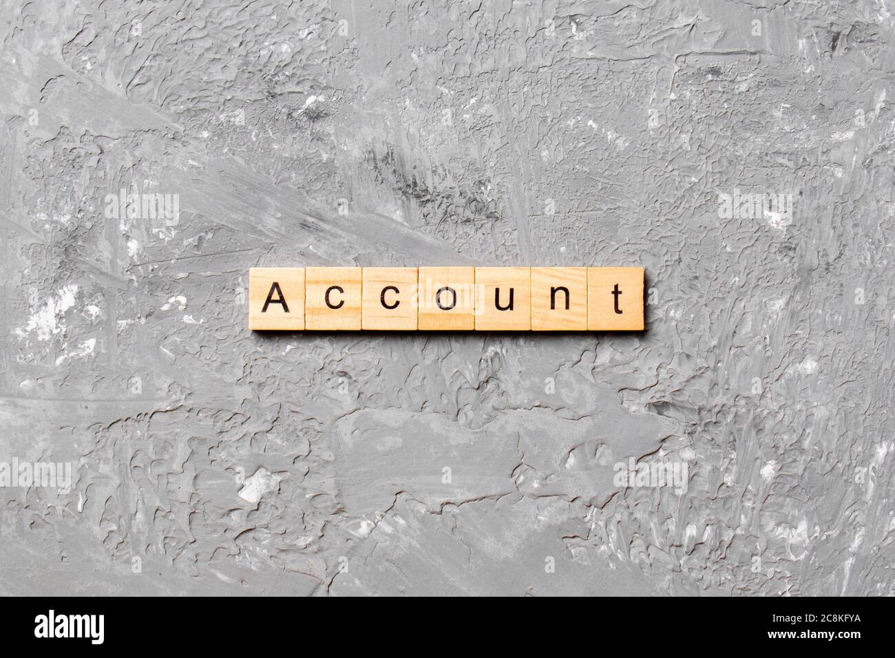 Account word written on wood block. Account text on cement table for ...
