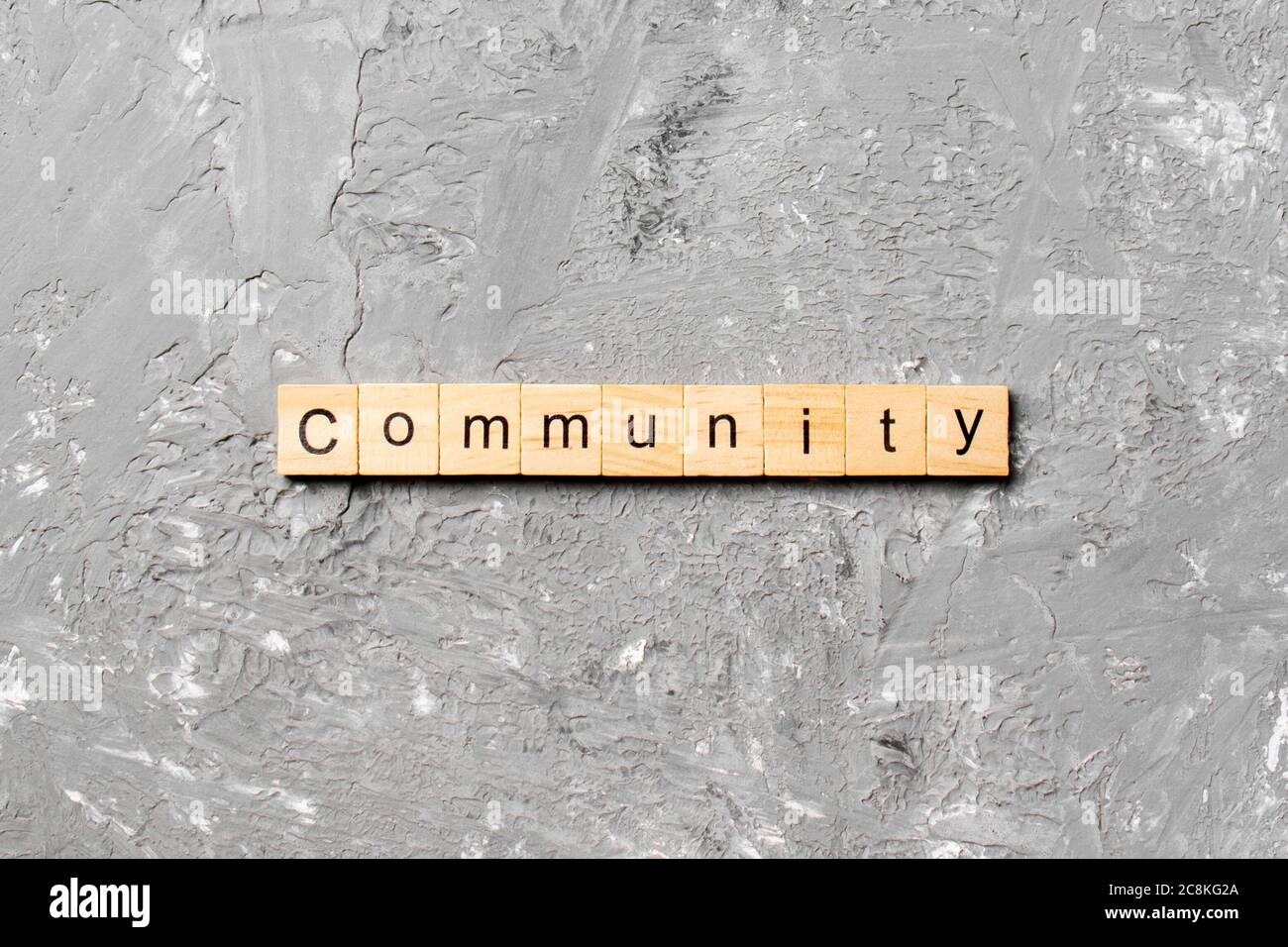 Community word written on wood block. Community text on table, concept ...