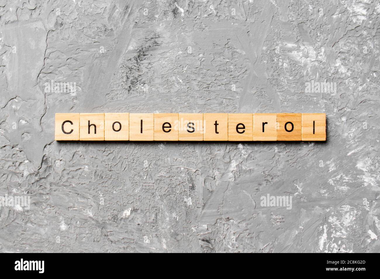 cholesterol word written on wood block. cholesterol text on table ...