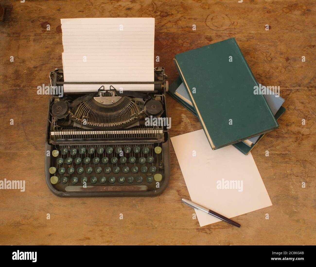 Old typewriter with paper and books hi-res stock photography and images ...