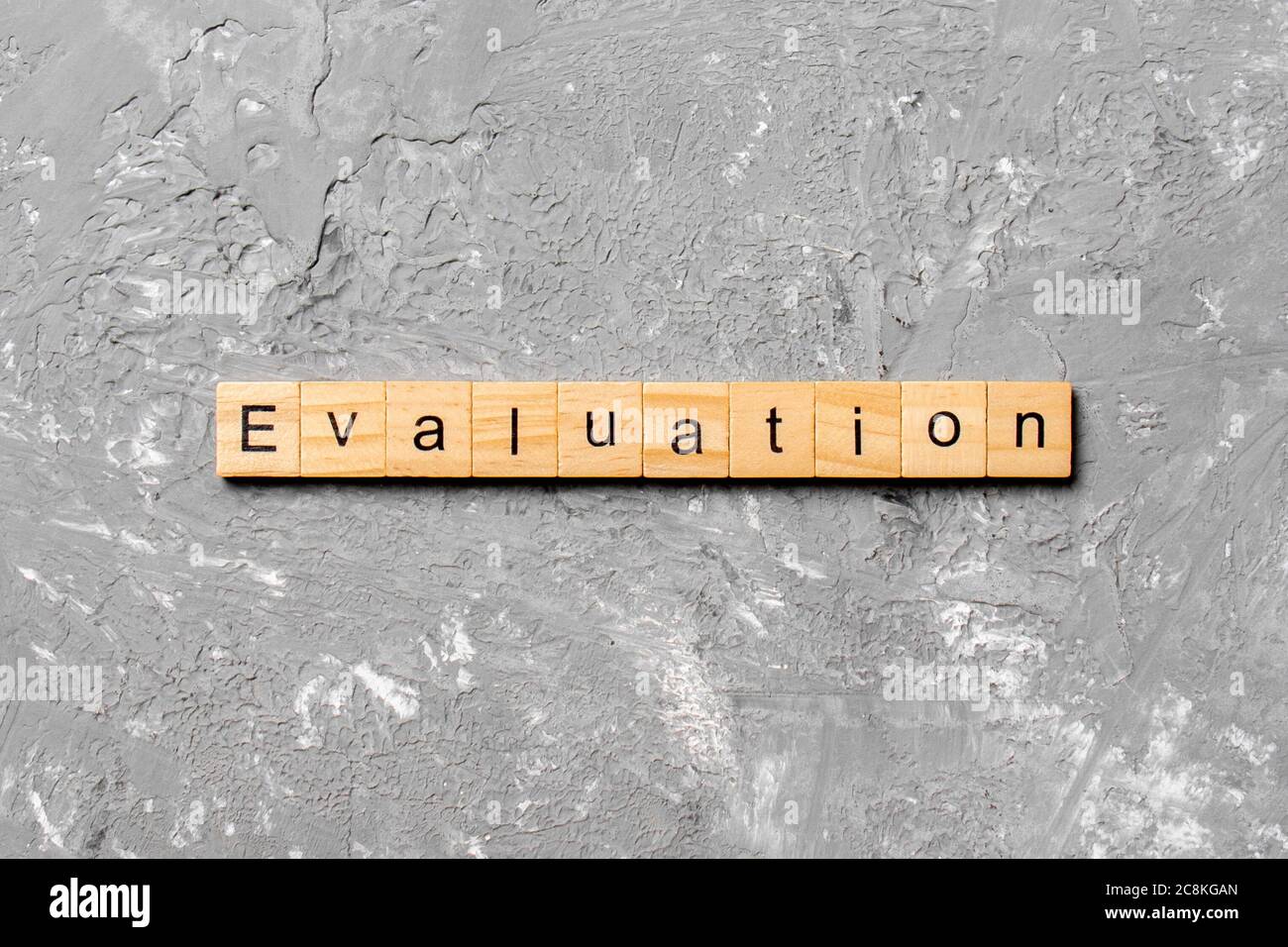 evaluation word written on wood block. evaluation text on table ...