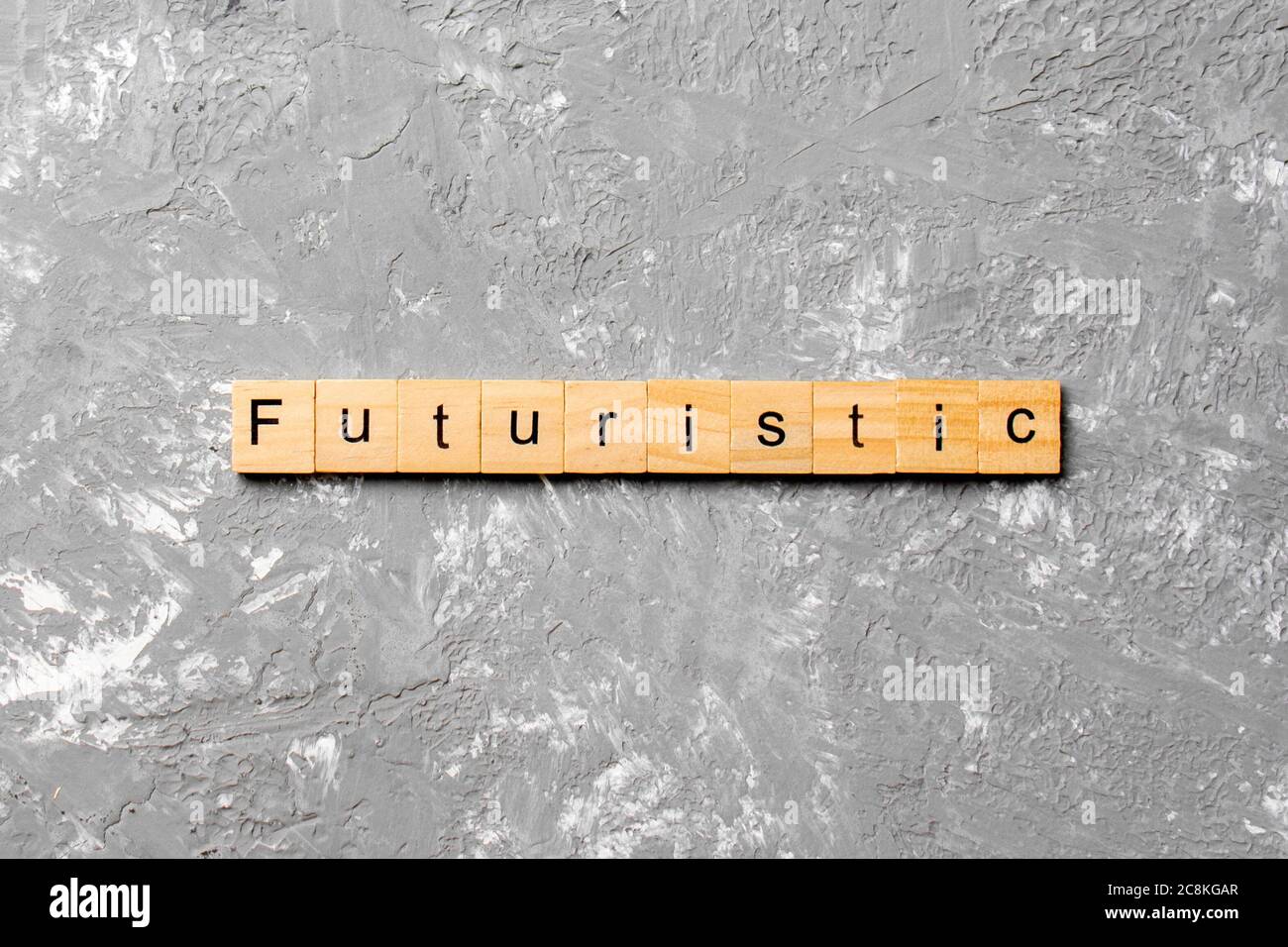 Futuristic word written on wood block. Futuristic text on cement table ...