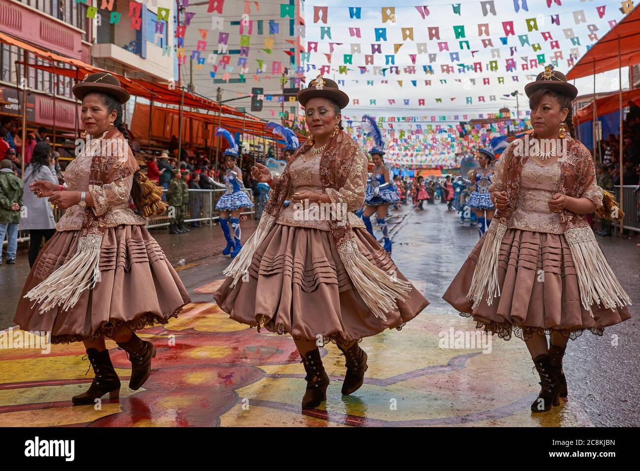 Morenada dancers in ornate costumes parade through the mining city of ...