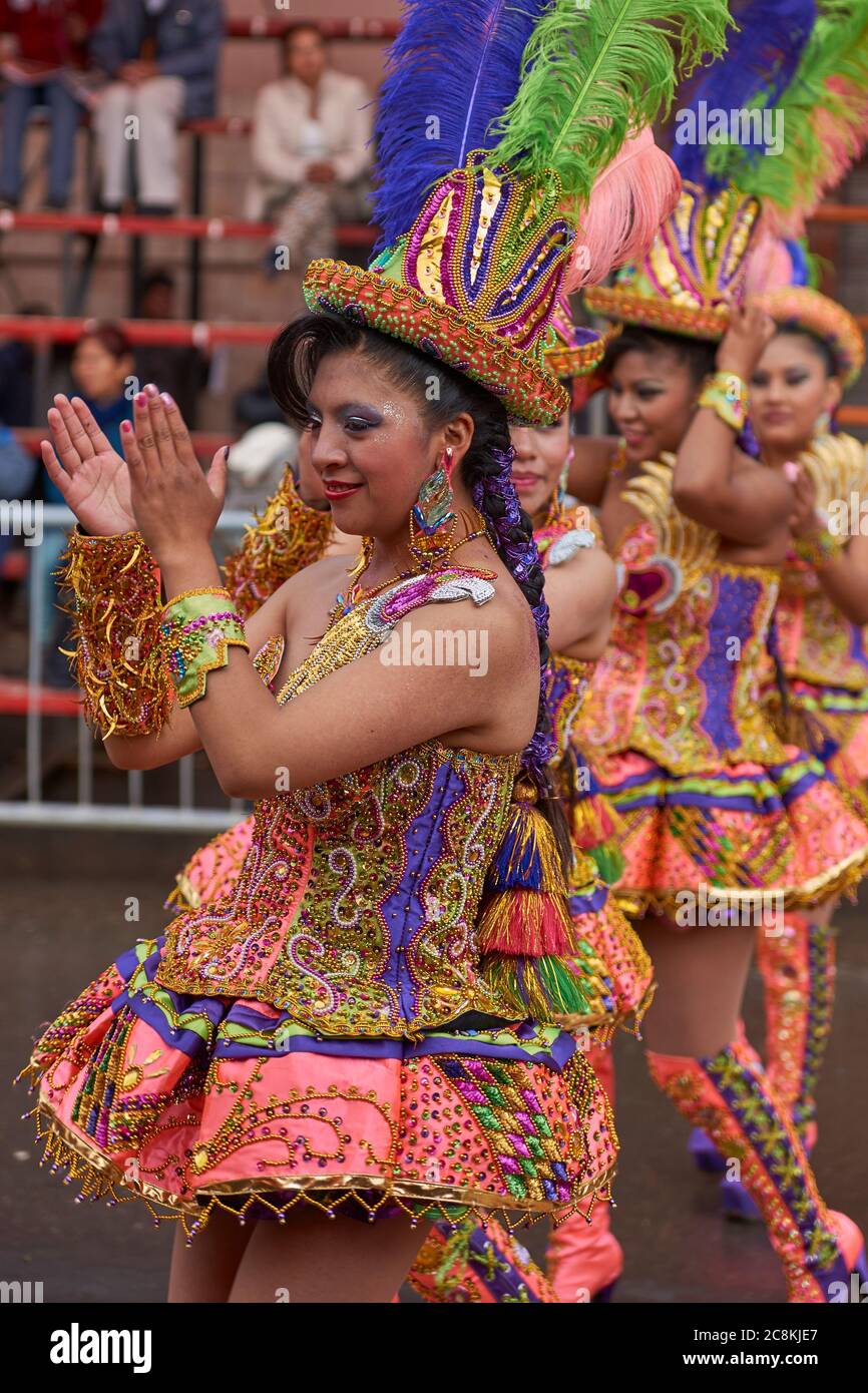 Morenada dancers in ornate costumes parade through the mining city of ...